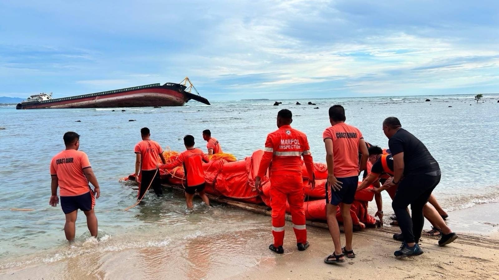 Authorities battle to contain oily waste spill after Philippines cargo ...